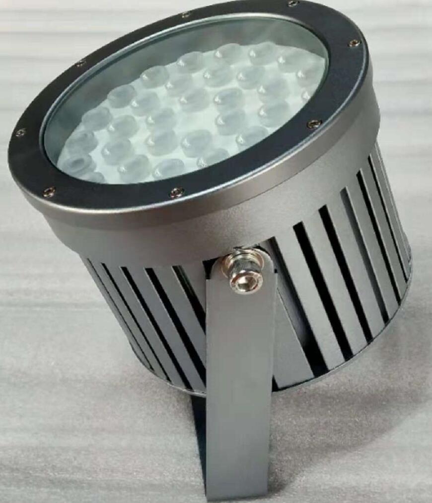 Floodlight luminaire with optic lens provide uniform lighting across ...